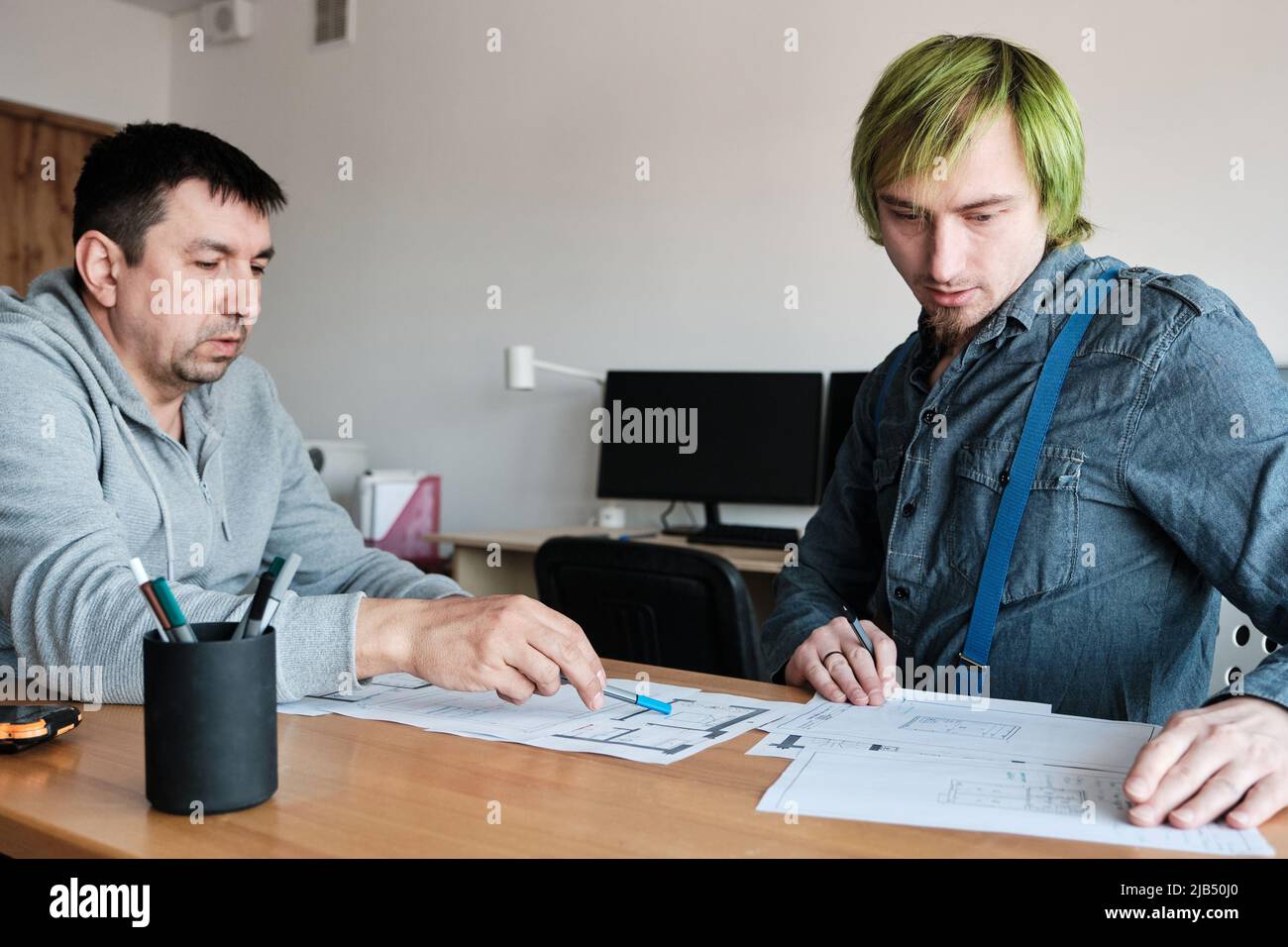 Two Architects are Working On the Project In Office. Two architects ...