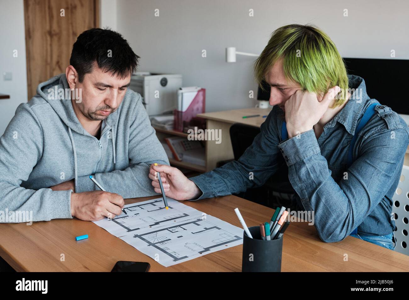 Team of two colleagues interior designers working on architectural ...