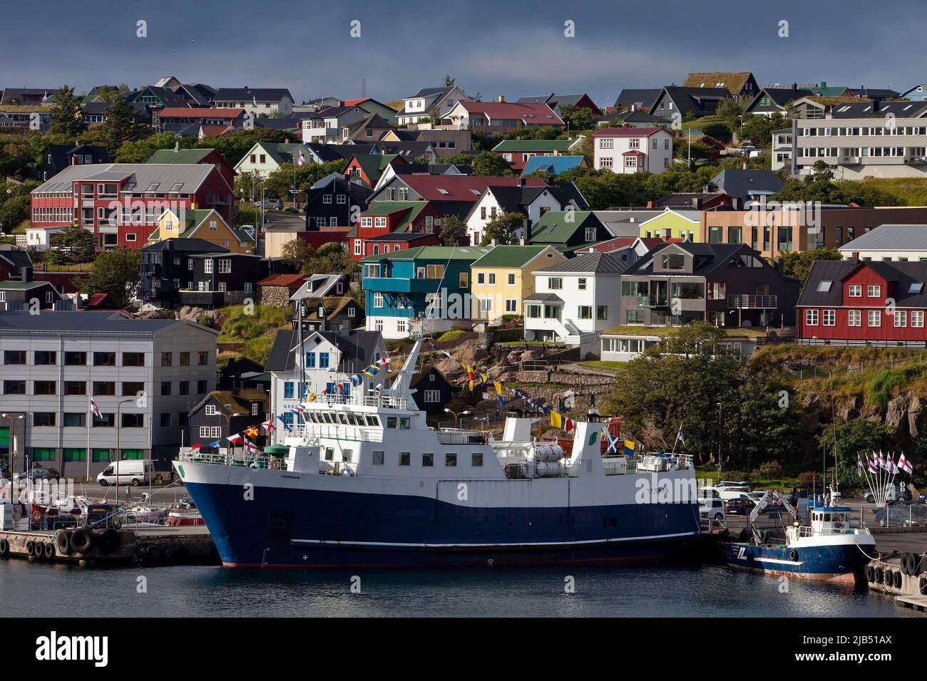Ship in the harbour overlooking the capital, Thorshavn, Streymoy, Faroe ...
