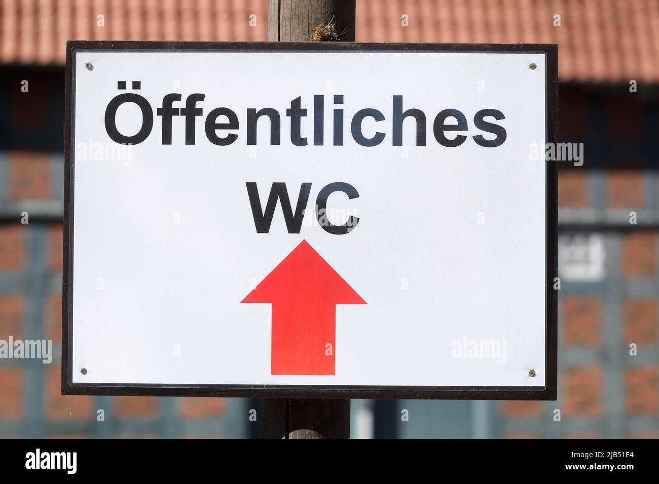 Sign public WC, toilet, arrow signpost, Germany Stock Photo - Alamy