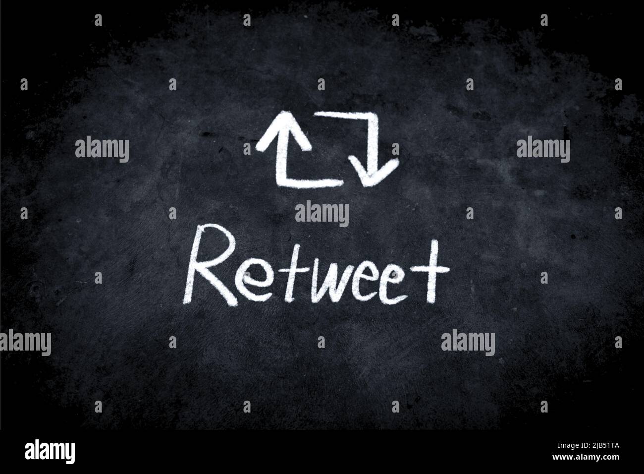 Phrase "Retweet" (often used on Twitter) by handwriting white colored ...