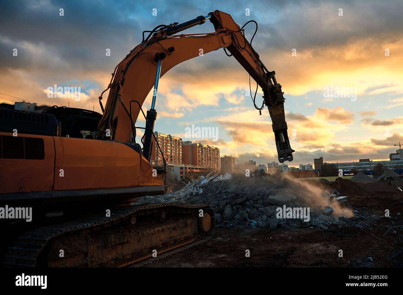 Excavator with concrete crusher on rig at demolition site Stock Photo ...