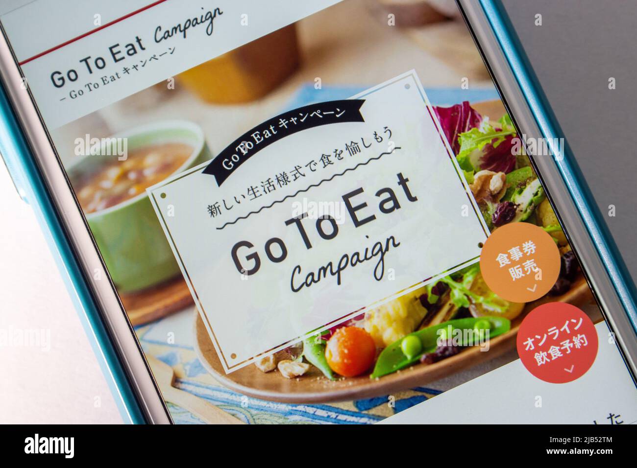 Closeup Japan's Go To Eat Campaign website on iPhone. Translation ...