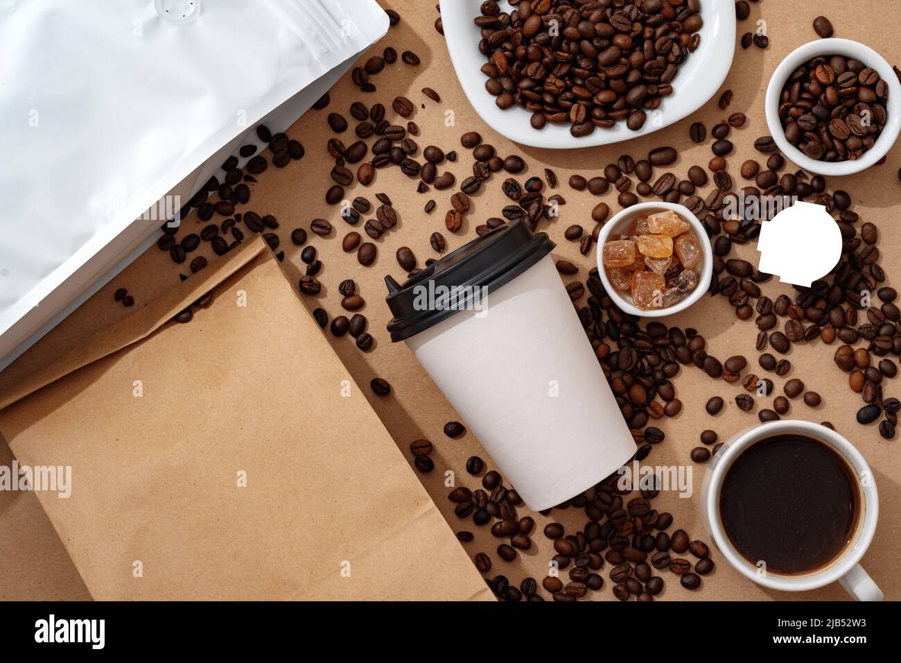 Blank brown kraft paper pouch bag with coffee beans and paper cup for ...