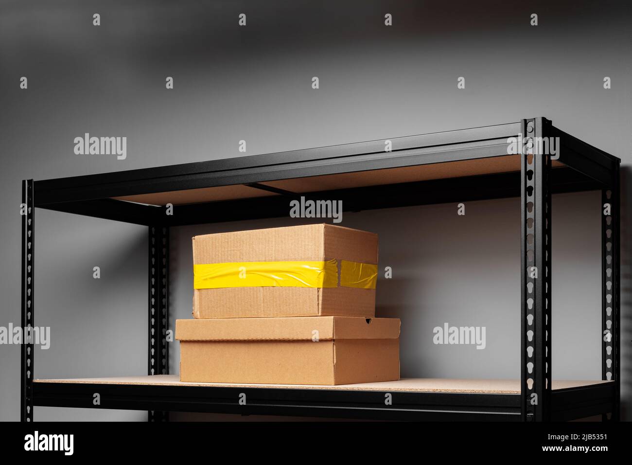 Rack shelves with paper boxes in warehouse Stock Photo - Alamy