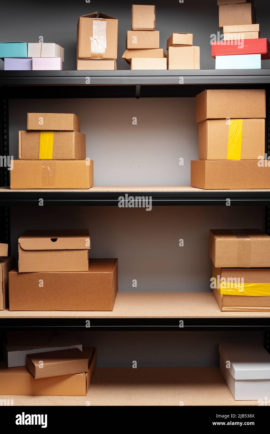 Rows of shelves with cardboard boxes in modern warehouse Stock Photo ...