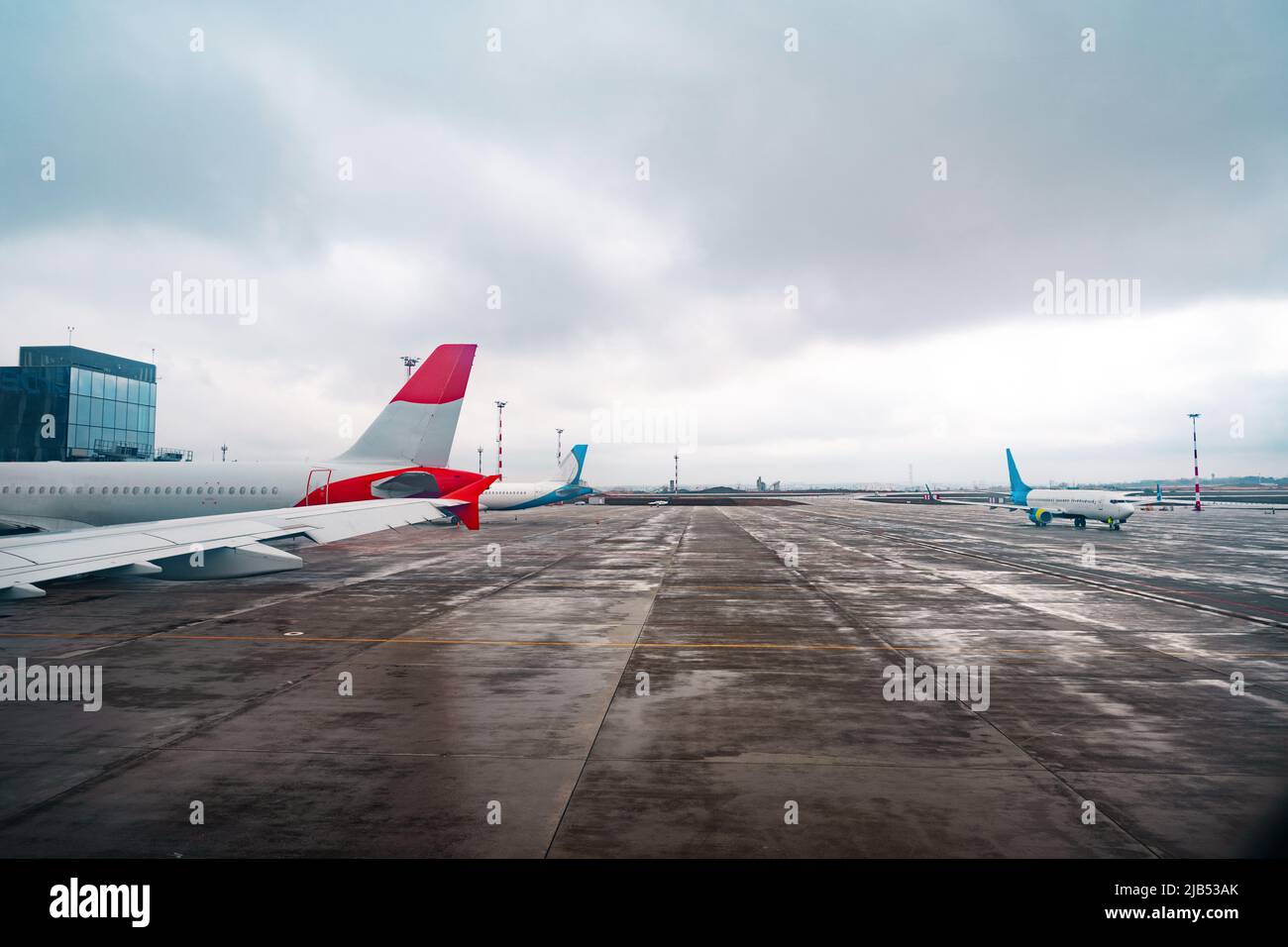 View of a passenger plane wing in airport Stock Photo - Alamy