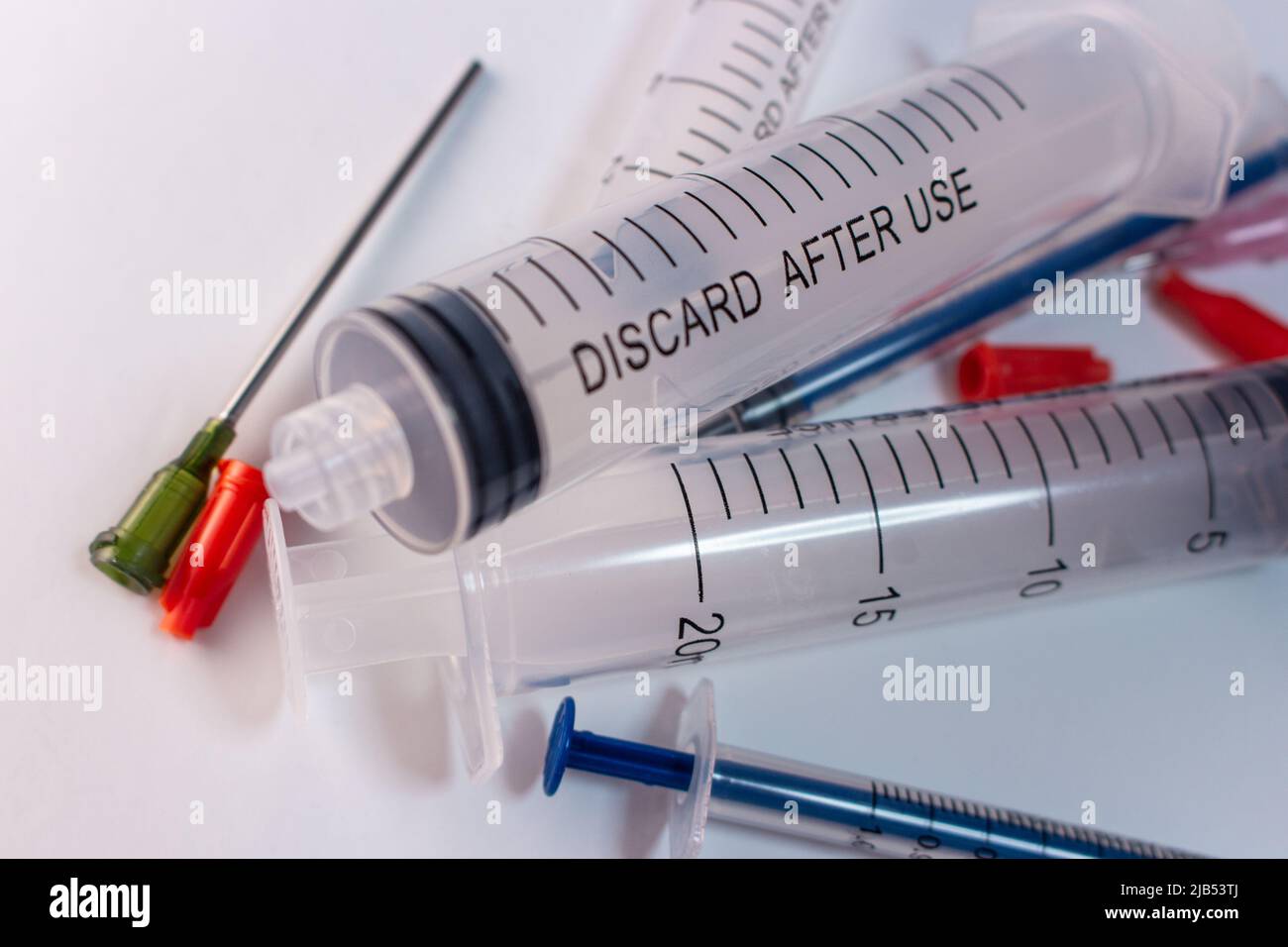 Medical syringe kit (needle, cap, syringe) on white background ...