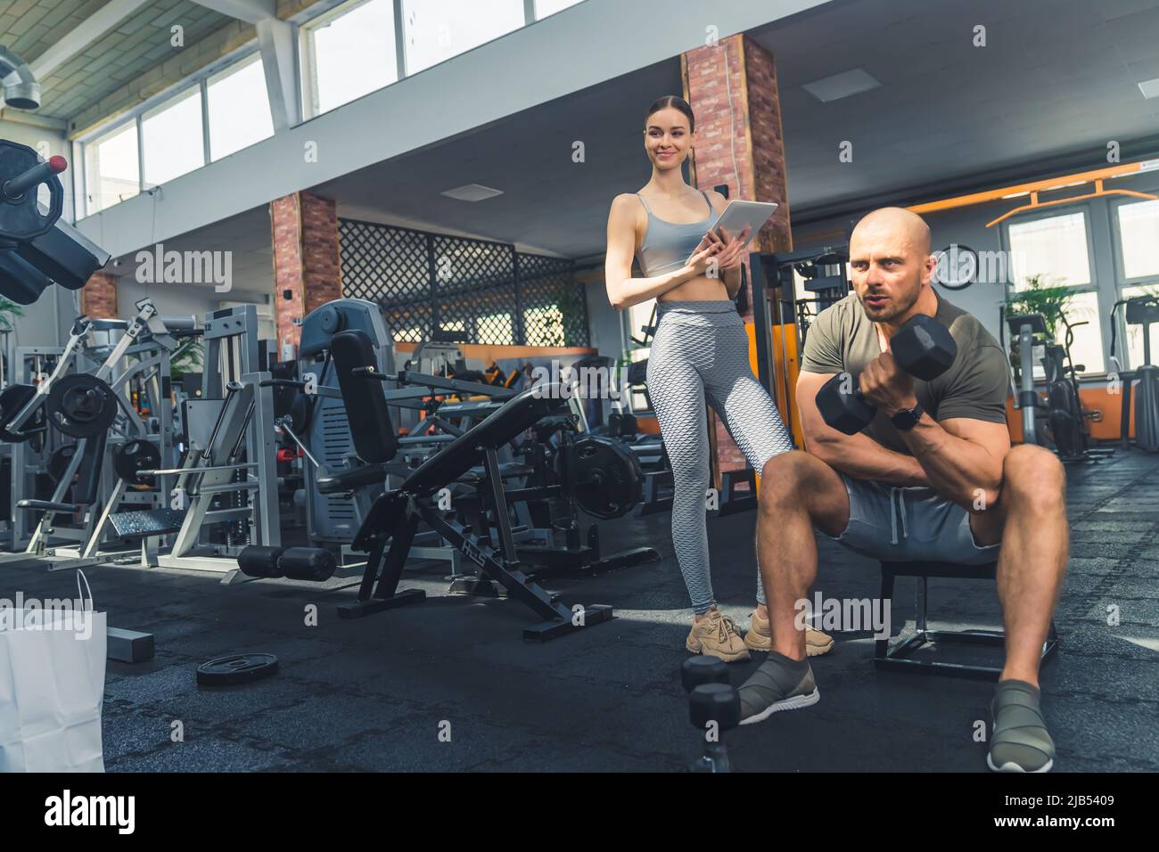 Mature woman with personal trainer hi-res stock photography and images ...