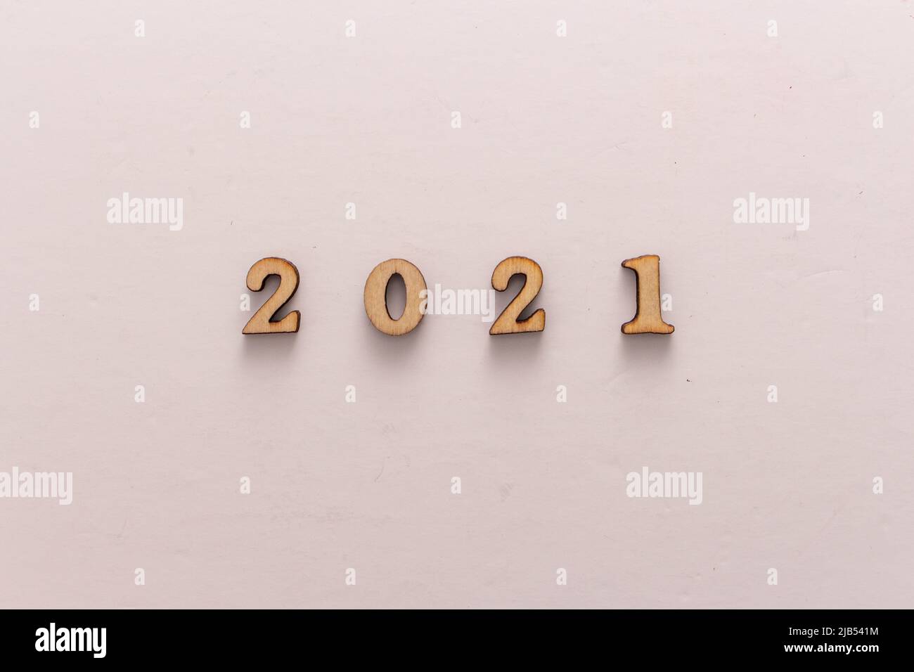 Wooden number 2021 on roughy white background. Concept image of ...