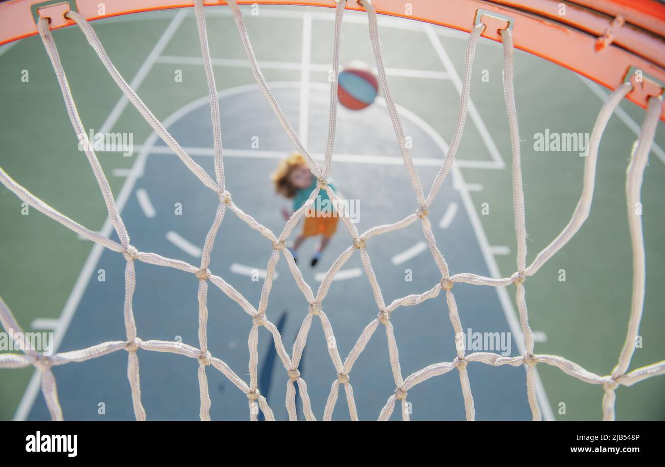Top view of flying ball to basket from kid play basketball Stock Photo ...