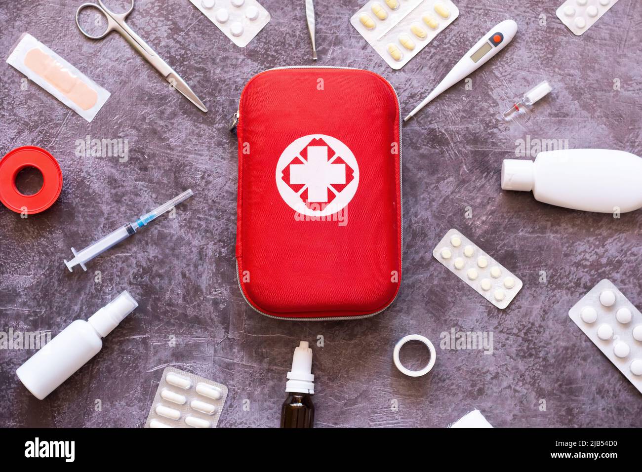 Home first aid kit, pills, thermometer on plain background Stock Photo ...
