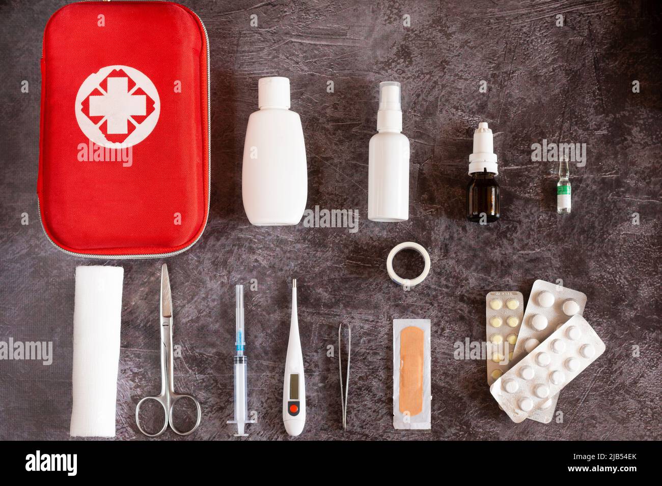 Home first aid kit, pills, thermometer on plain background Stock Photo ...