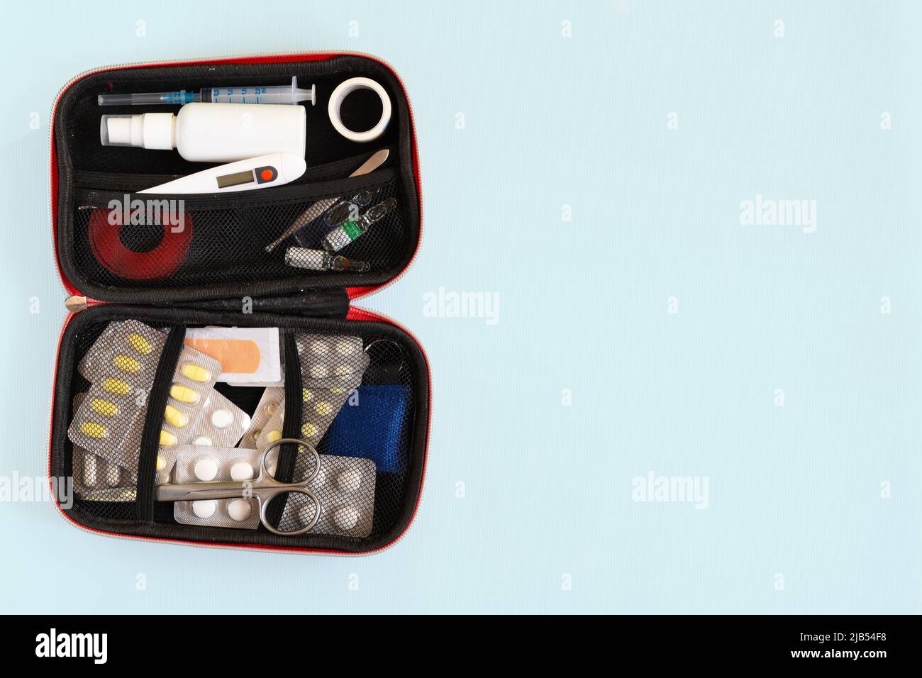 Home first aid kit, pills, thermometer on plain background Stock Photo ...