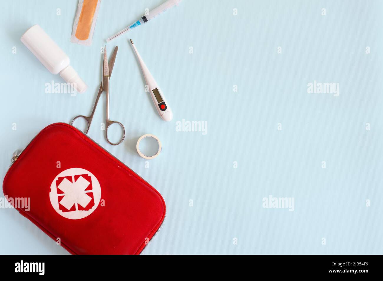 Home first aid kit, pills, thermometer on plain background Stock Photo ...