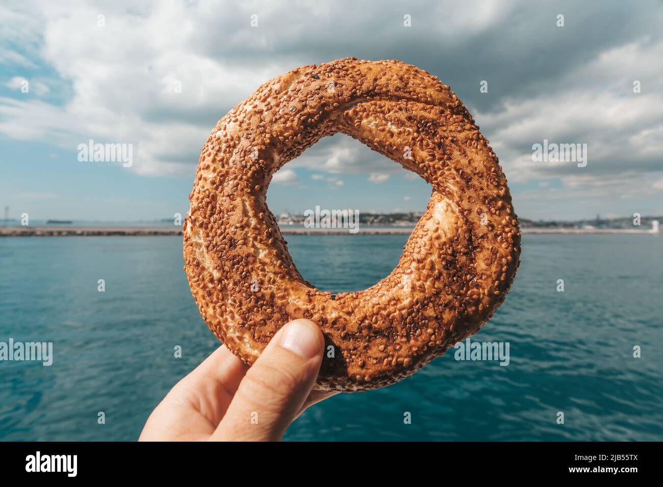 Simit in hand hi-res stock photography and images - Alamy
