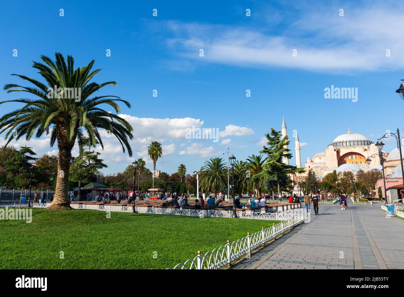 The central square of Istanbul. Palm trees and a crowd of tourists ...