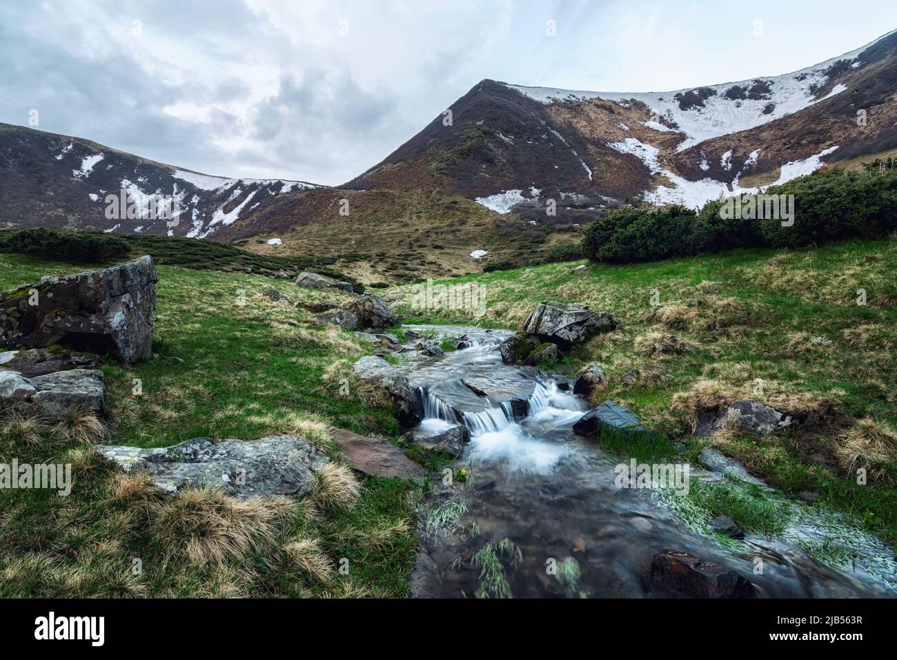 Mountain river in the highlands, green slopes of the Ukrainian ...