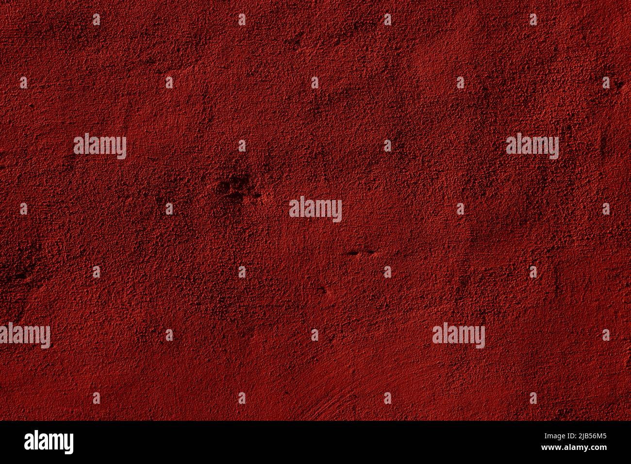 Crimson colored wall background with textures of different shades of ...