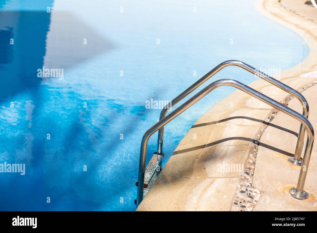 Stair around outdoor swimming pool in hotel resort for travel vacation ...
