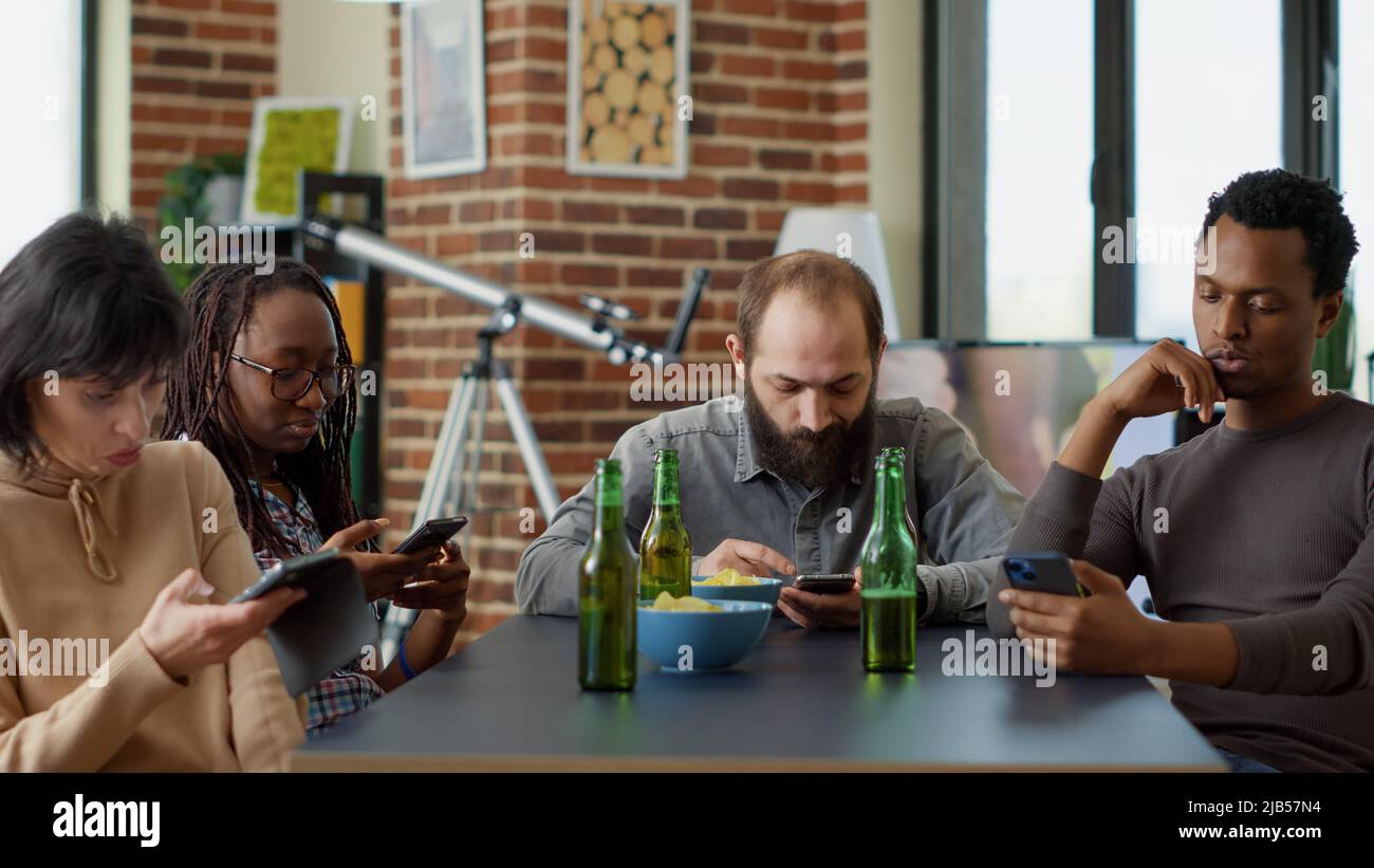 Millennial people scrolling through internet on smartphone instead of ...