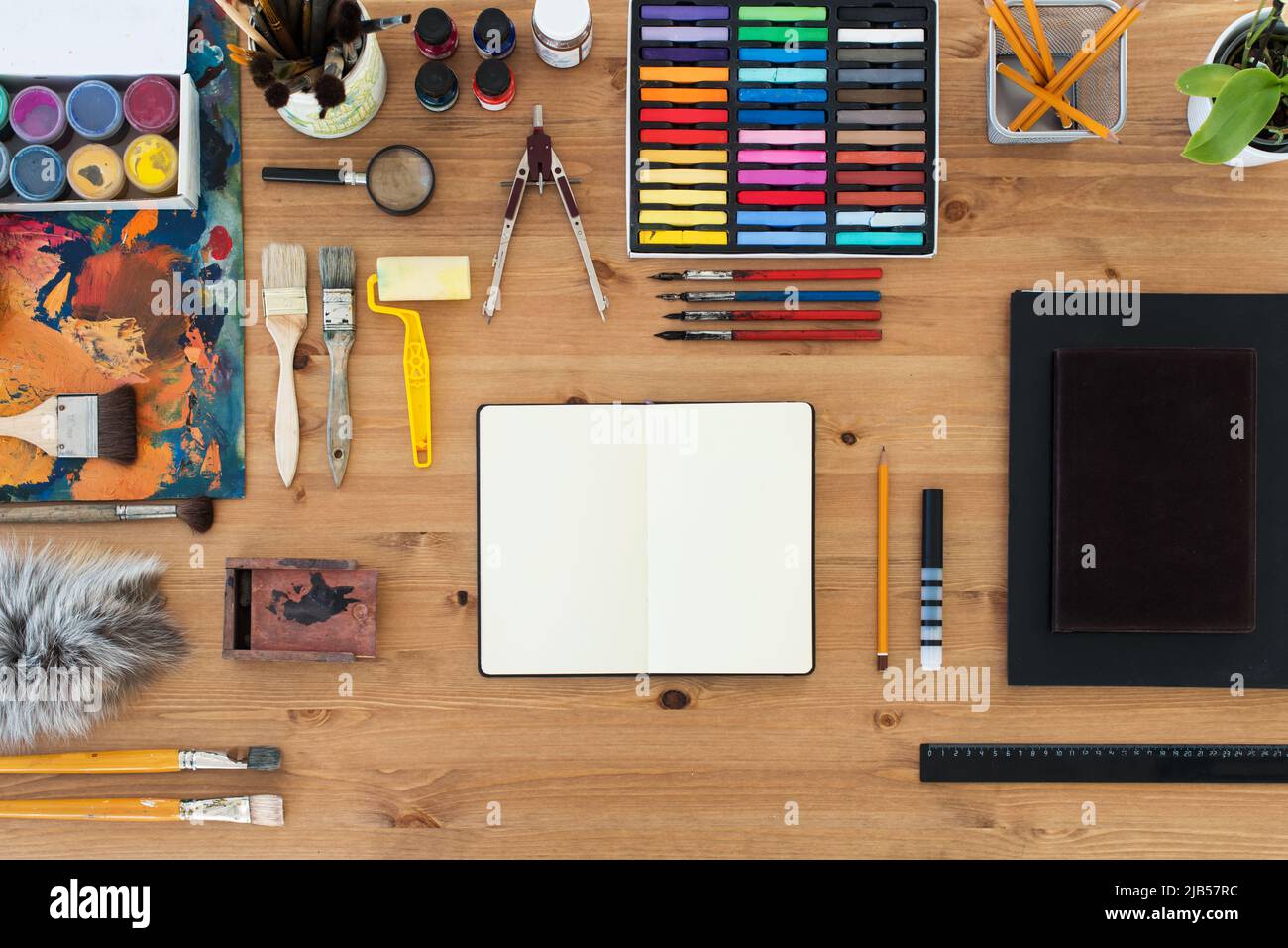 Painter workplace top view. Wooden table of an artist with art tools ...