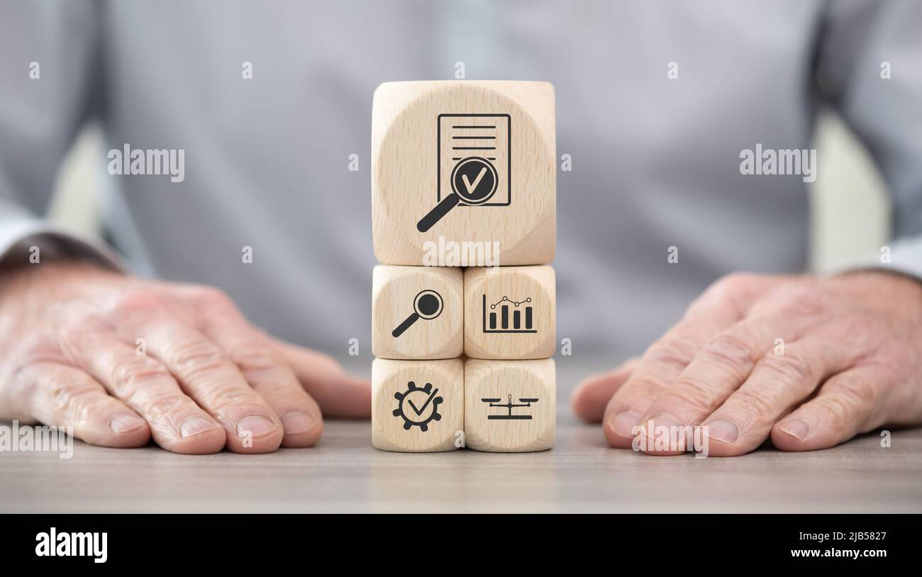Wooden blocks with symbol of assessment concept Stock Photo - Alamy