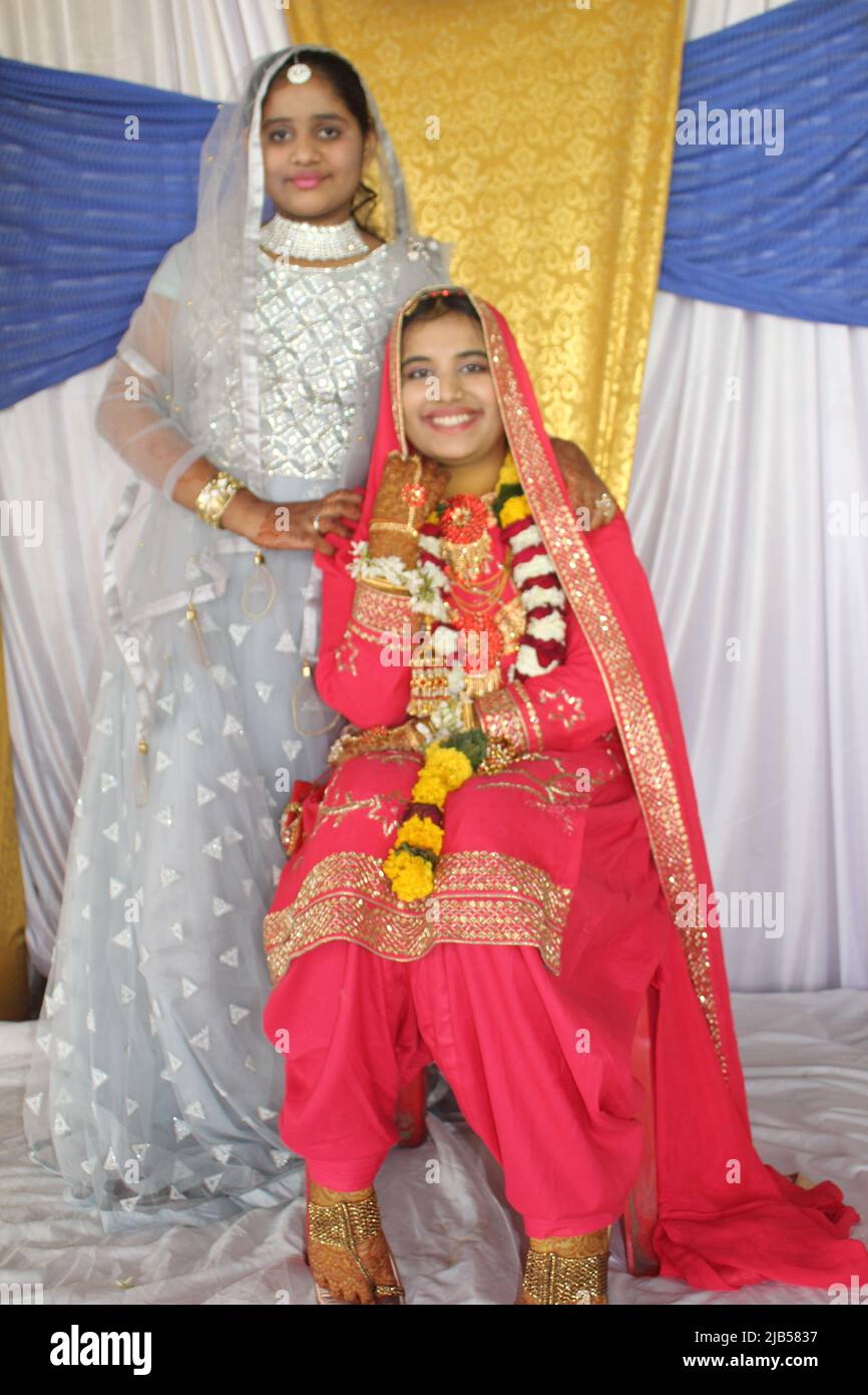 Portrait of adorable smiling Pakistani Muslim girl in traditional suit ...