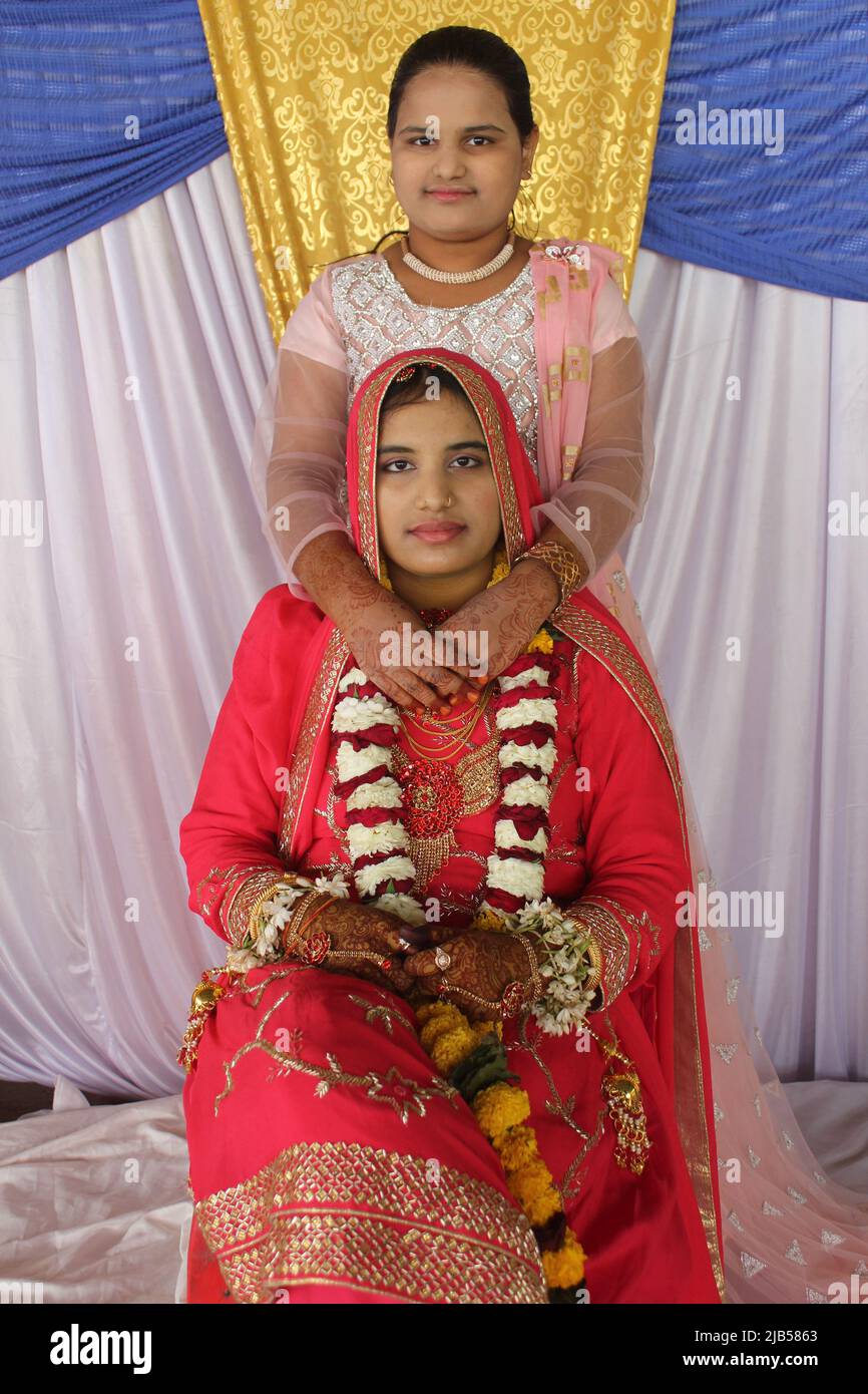 Portrait of adorable smiling Pakistani Muslim girl in traditional suit ...