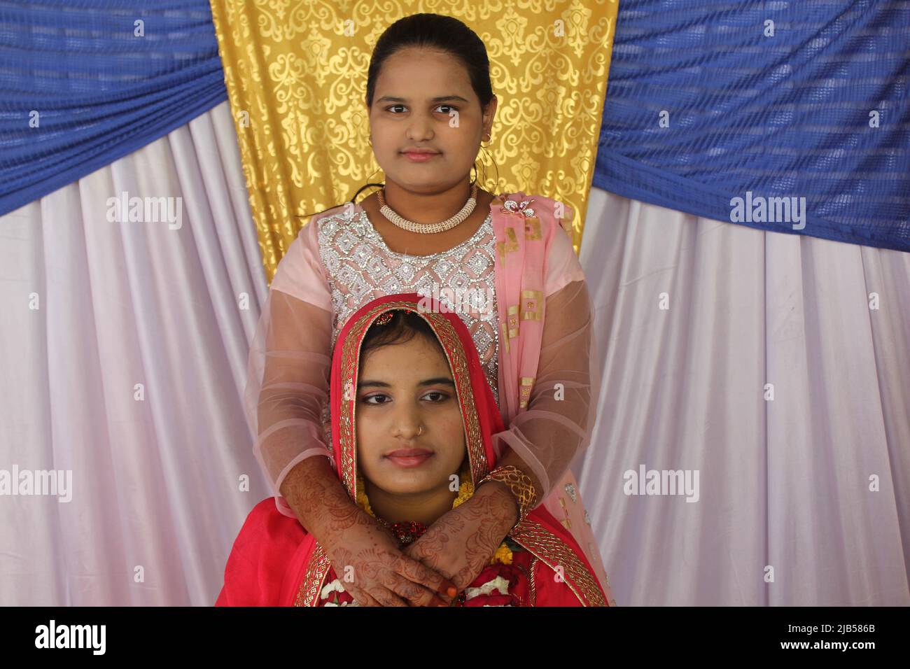 Portrait of adorable smiling Pakistani Muslim girl in traditional suit ...
