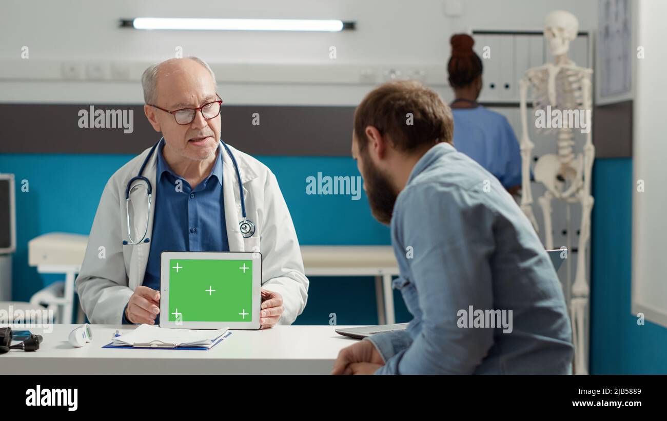Physician holding horizontal greenscreen hi-res stock photography and ...