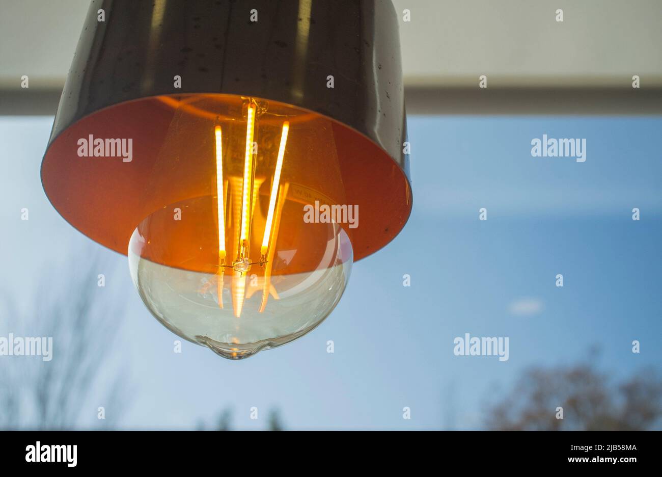 Light bulb with blue background hi-res stock photography and images - Alamy