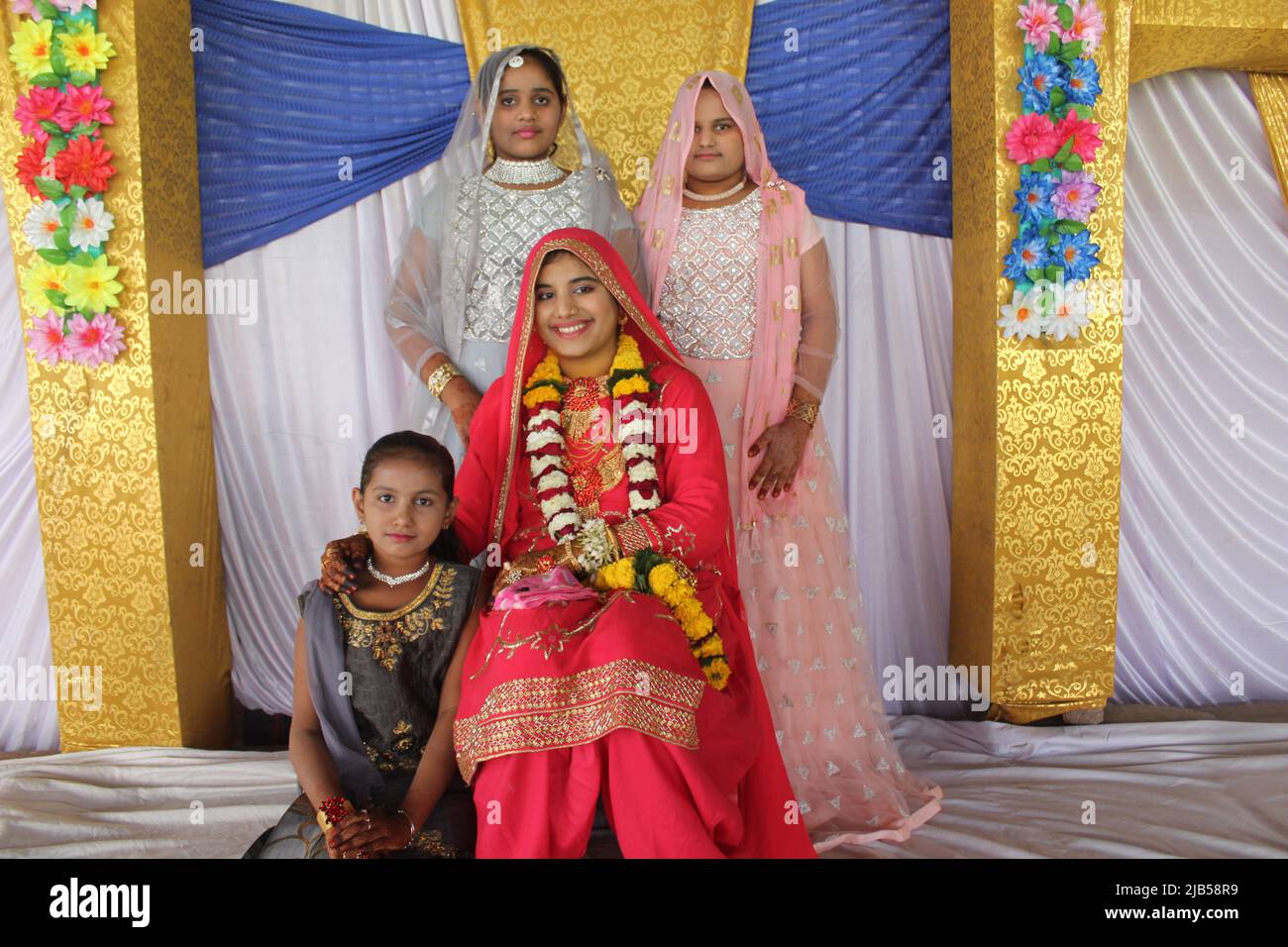 Portrait of adorable smiling Pakistani Muslim girl in traditional suit ...