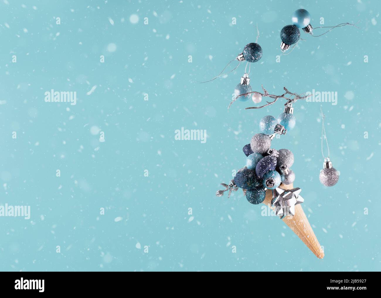 Blue background for new year with cone and decoration. Space for text ...