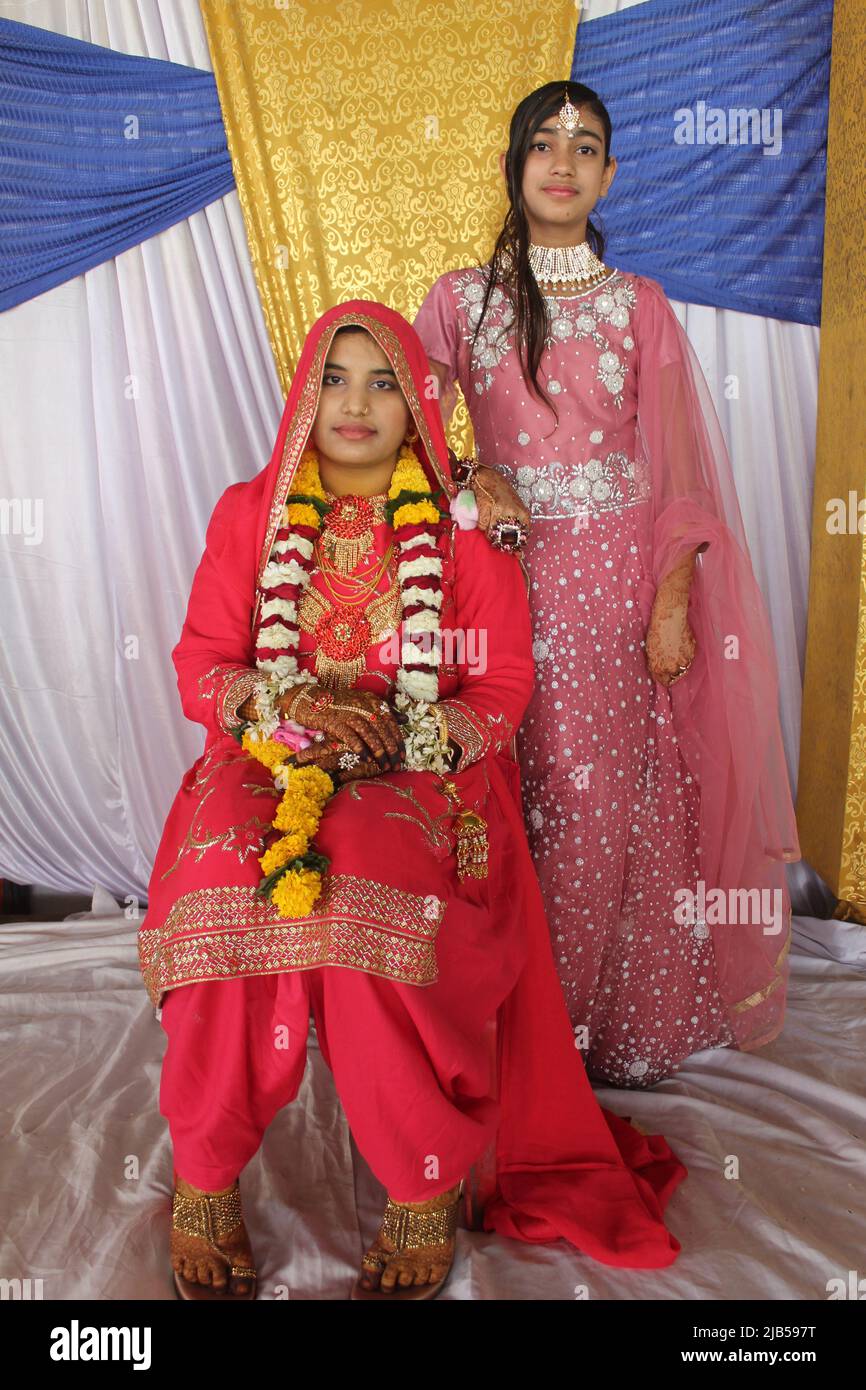 Portrait of adorable smiling Pakistani Muslim girl in traditional suit ...