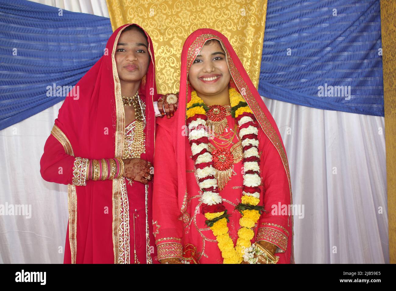 Portrait of adorable smiling Pakistani Muslim girl in traditional suit ...