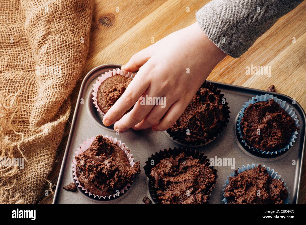 homemade chocolate cupcakes in cupcake mold on the table in the kitchen ...