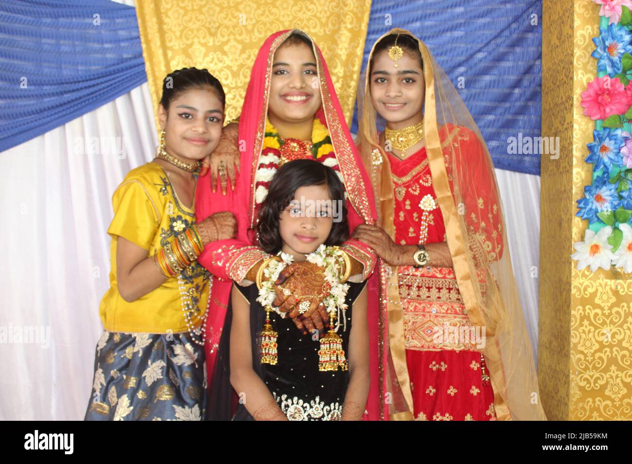 Portrait of adorable smiling Pakistani Muslim girl in traditional suit ...