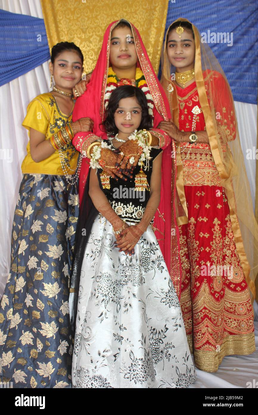 Portrait of adorable smiling Pakistani Muslim girl in traditional suit ...