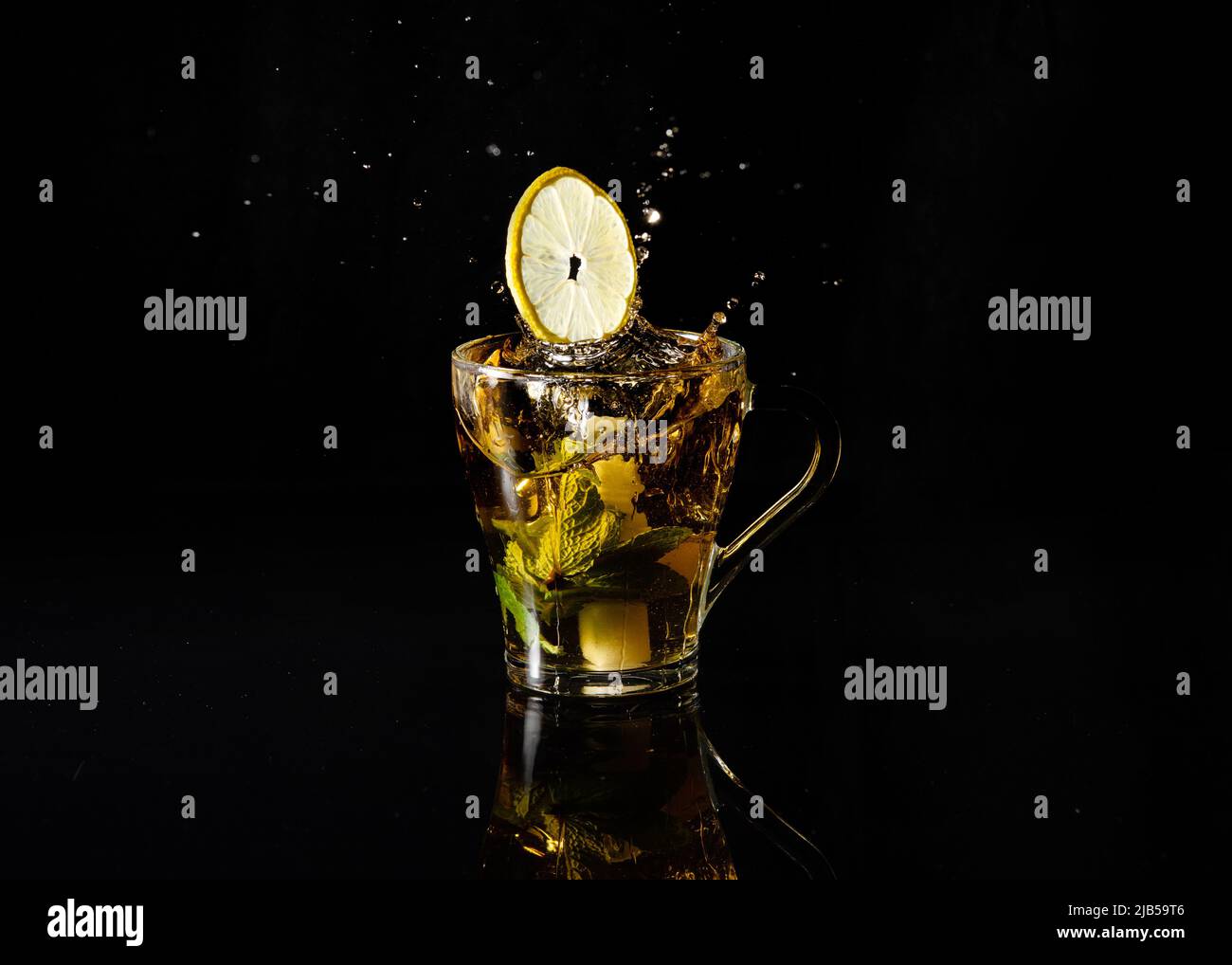 Tea cup with a dynamic splash hi-res stock photography and images - Alamy
