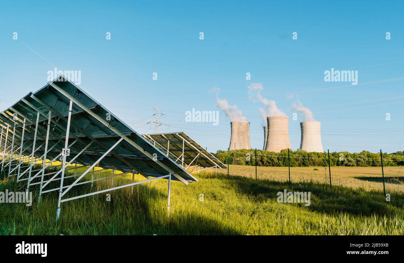 Solar photovoltaics farm and nuclear power plant with cooling towers in ...
