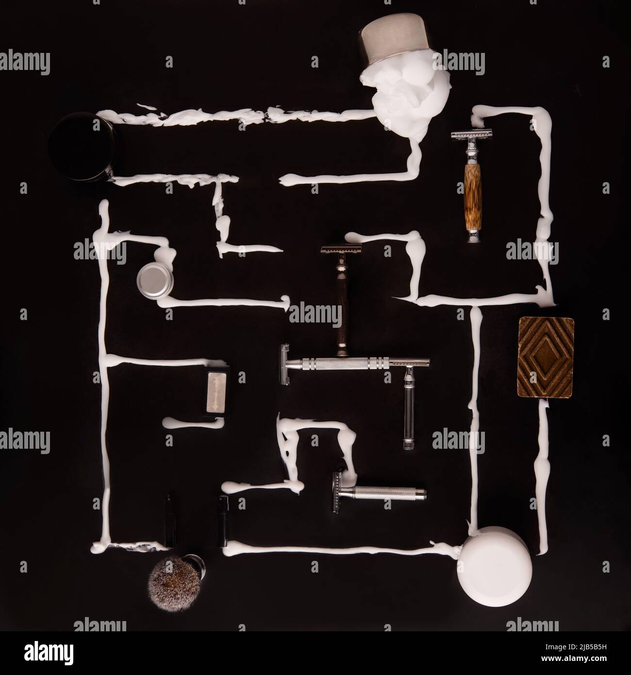 razors, brush, foam and soap laid out like a maze. concept advertising ...