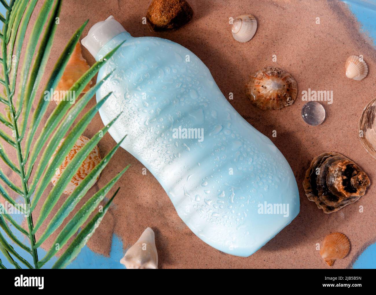 mint bottle for cream, shaving foam, spray, shampoo with drops, lying ...