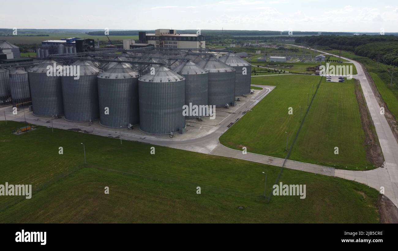 long rows of huge white gas tanks connected with pipeline system at ...
