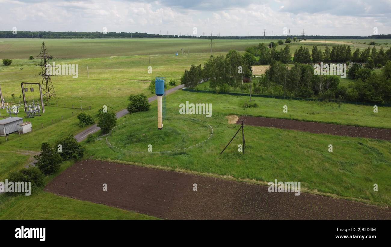 Electrical substation - grid of high voltage power lines and wires ...