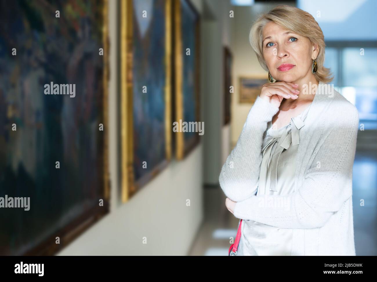 Adult woman in museum Stock Photo - Alamy