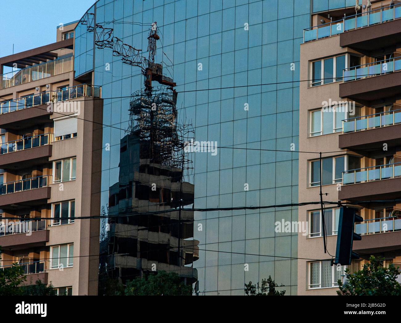 Steel and glass architecture, reflection of a building under construction, Sofia, Bulgaria ...