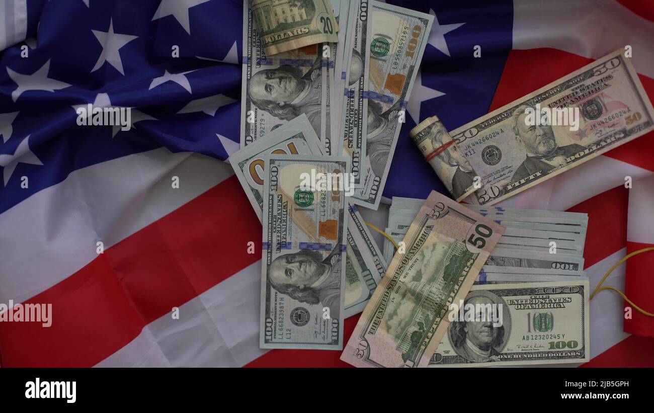 Stack of money on American Flag. dollars Stock Photo - Alamy