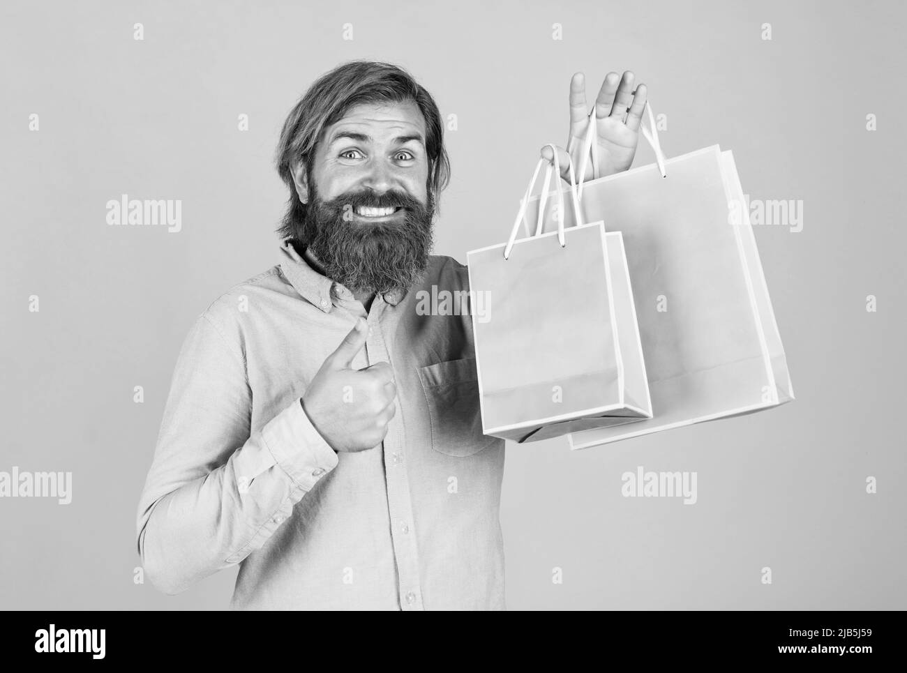look over there. successful shopaholic. bearded man ready for holiday ...