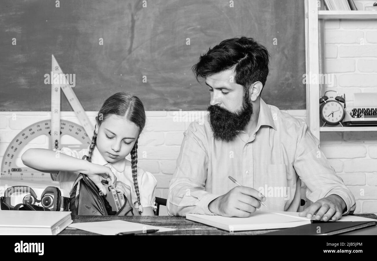 Study is fun. School teacher and schoolgirl. Homeschooling with father ...